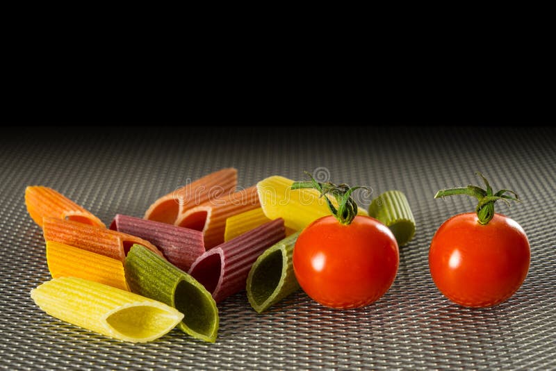 Color pasta with tomatoes stock photo. Image of heavy - 90739784