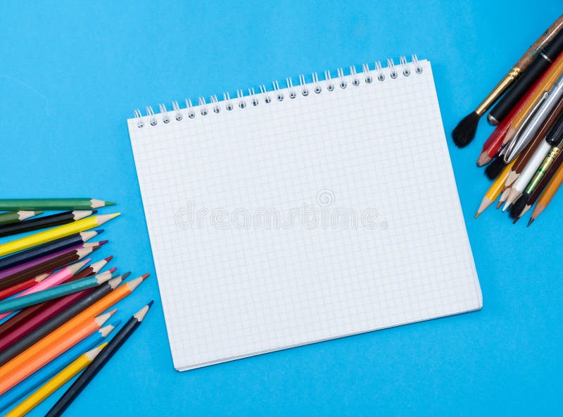 Color Pencils for Drawing and Notebook on a Blue Stock Image - Image of ...