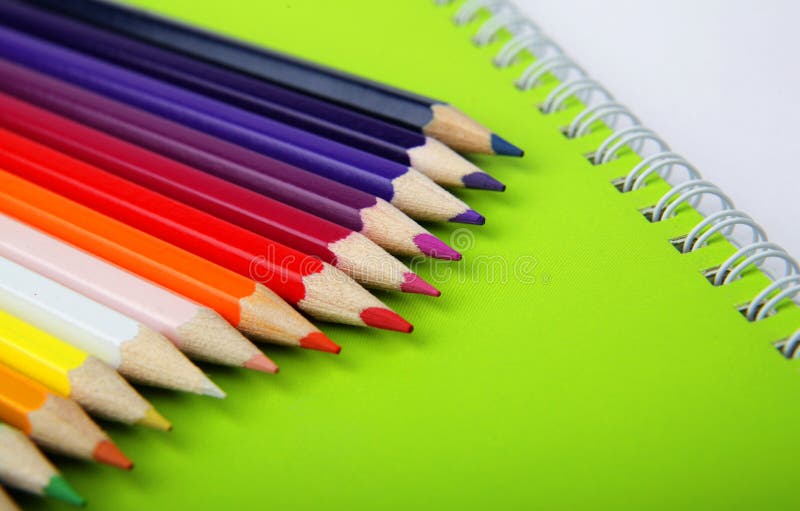 Color Pencils on Green Notebook Stock Image - Image of closeup ...