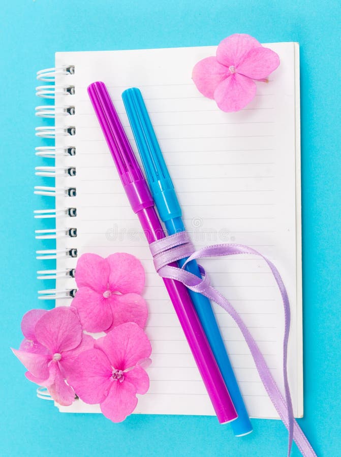 Color pens on a notebook stock photo. Image of books - 82887222
