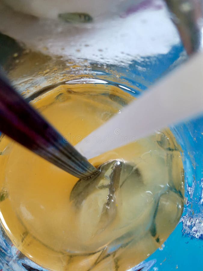 A Color Photo of Orange Ice in a Glass Stock Photo - Image of green ...