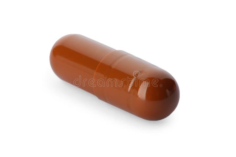 One Brown Pill on White Background. Medicinal Treatment Stock Image ...