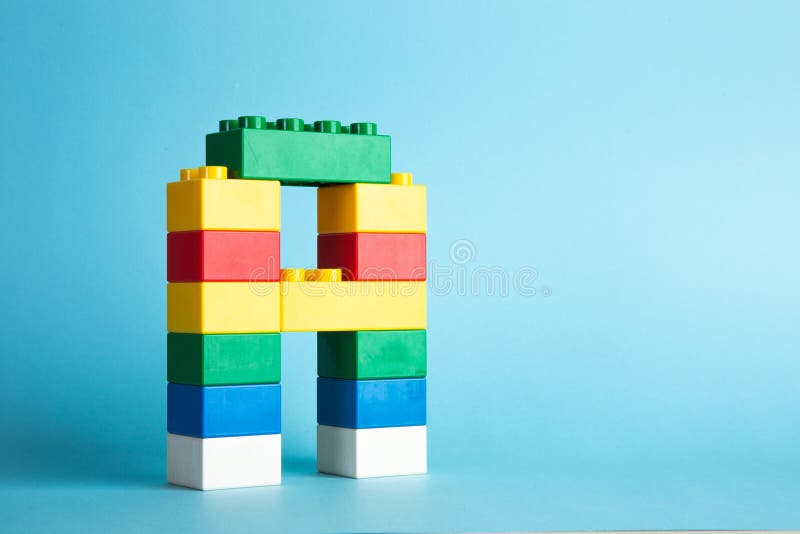 Color Plastic Building Blocks on Blue Background Editorial Photo ...