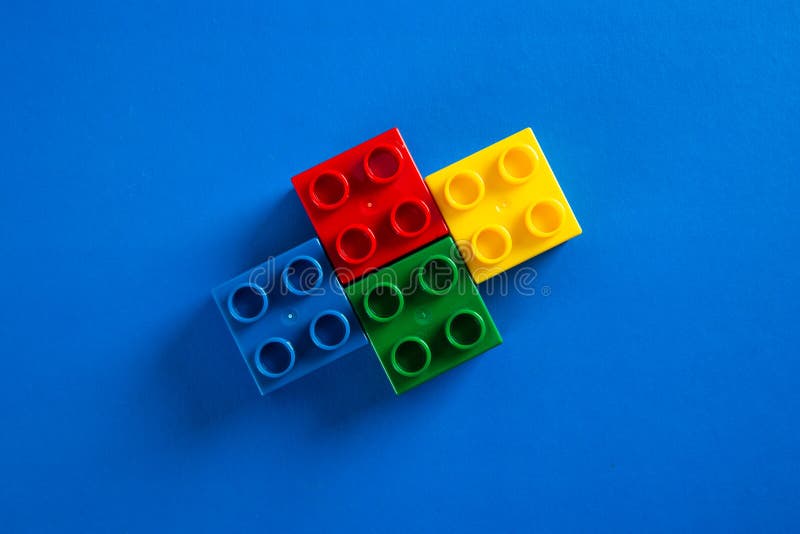 Color Plastic Building Blocks on Blue Background Stock Image - Image of ...