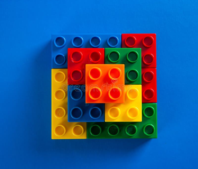 Color Plastic Building Blocks on Blue Background Stock Image - Image of ...