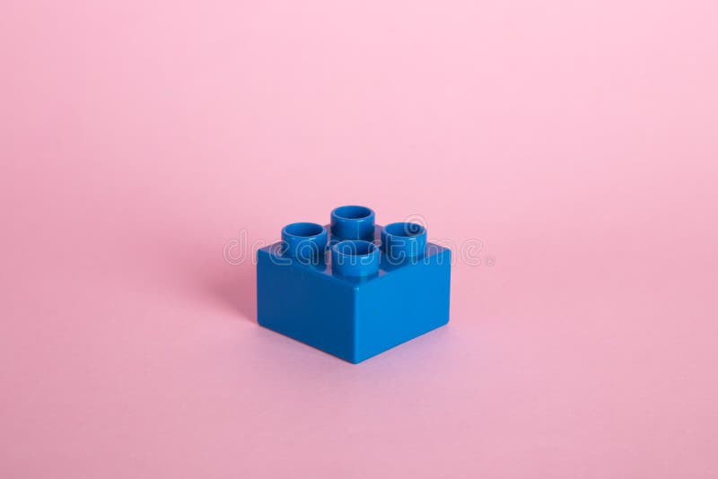 Color Plastic Building Blocks on Pink Background Stock Photo - Image of ...