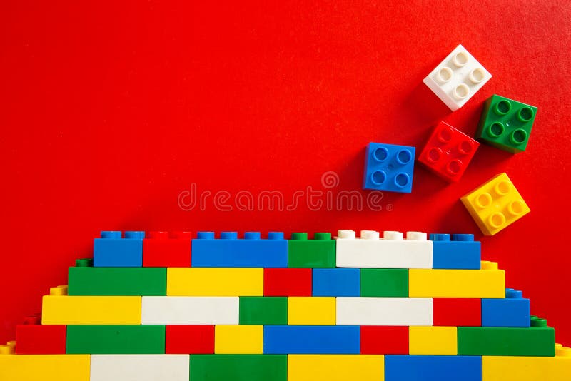 Color Plastic Building Blocks on Red Background Stock Image - Image of ...