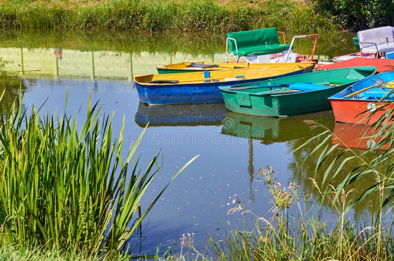 Color Row Boats at a Lake in the Park, Sunlight Effect Stock Photo ...
