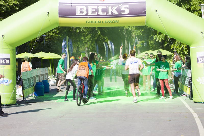 Runner Passing Under the Green Gate Editorial Stock Image - Image of ...