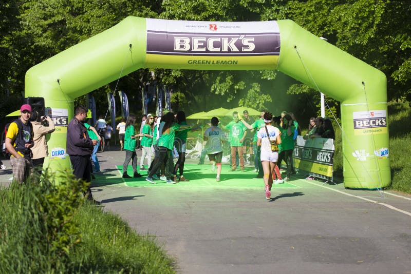 Runner Passing Under the Green Gate Editorial Stock Image - Image of ...