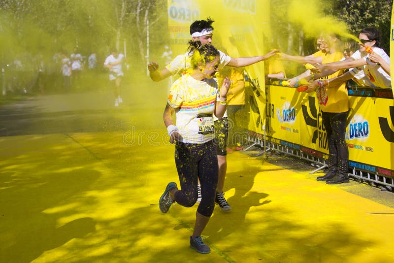Runner Passing Under the Yellow Gate Editorial Photo - Image of ...