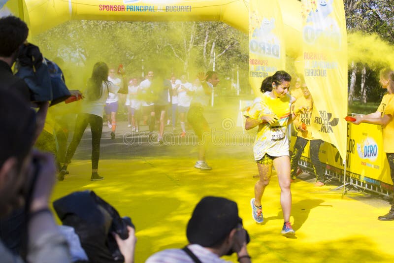 Runner Passing Under the Yellow Gate Editorial Stock Image - Image of ...