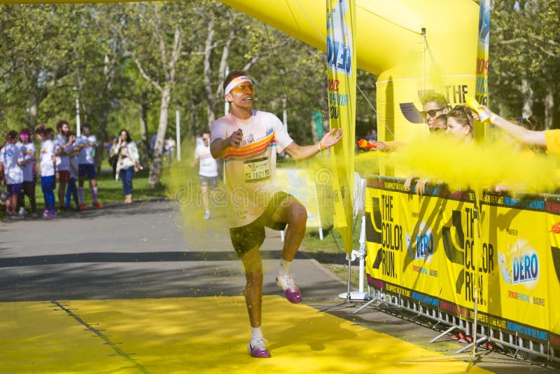 Runner Passing Under the Yellow Gate Editorial Stock Image - Image of ...
