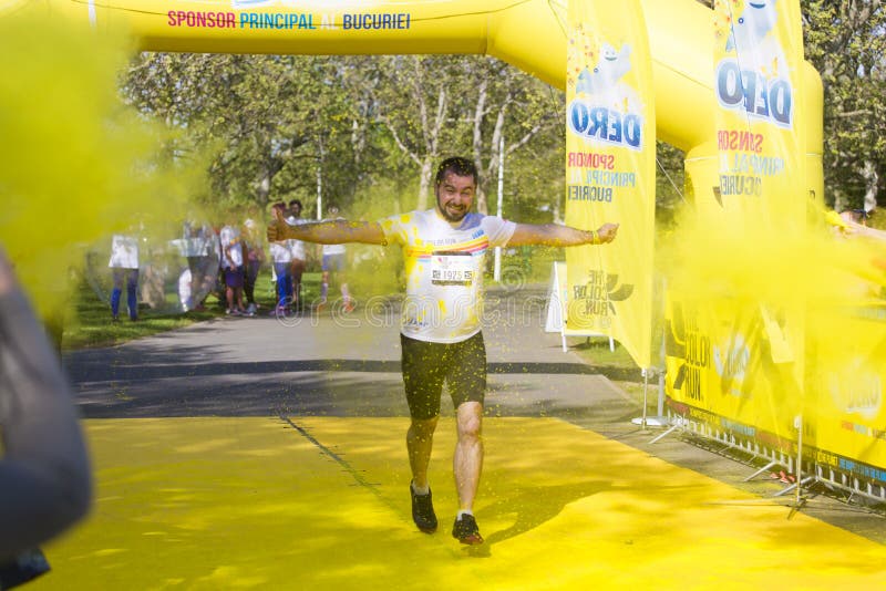 Runner Passing Under the Yellow Gate Editorial Stock Photo - Image of ...