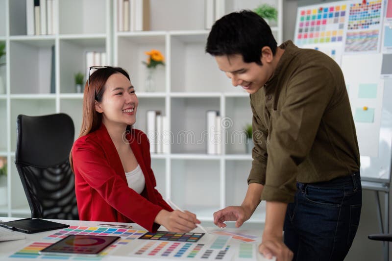 Color Selection and Teamwork. Colleagues Collaborating on a Visual ...