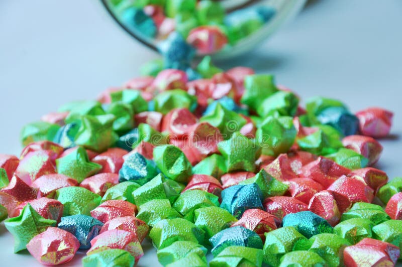 Color Star Paper Pour from Glass Bottle Stock Image - Image of glass ...