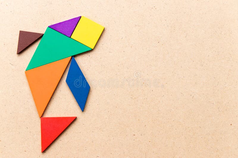 Color Tangram in Fish or Shark Shape on Wood Bacground Stock Image ...