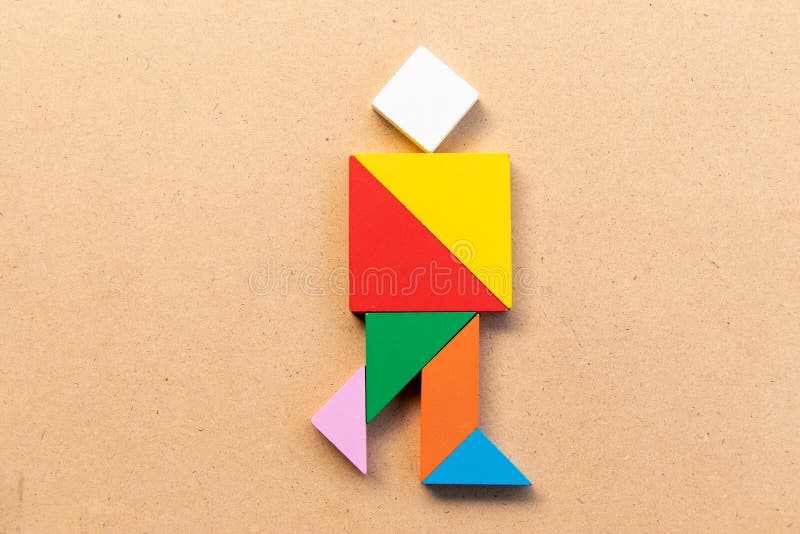 Color Tangram in Walking Man Shape on Wood Bacground Stock Image ...