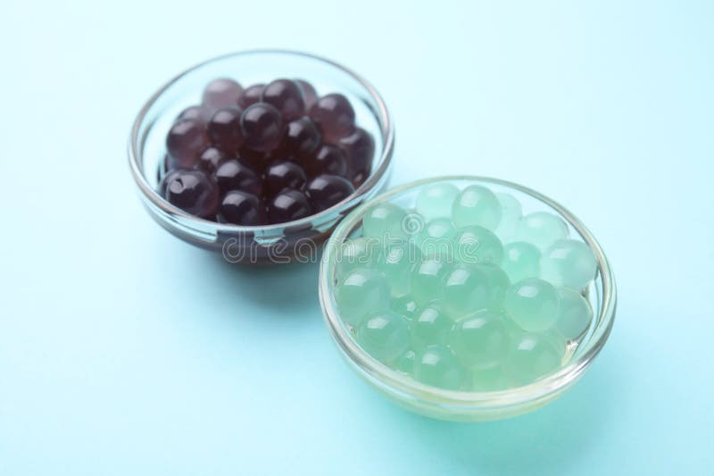 Color Tapioca Pearls in Bowls on Light Blue Background, Closeup Stock ...