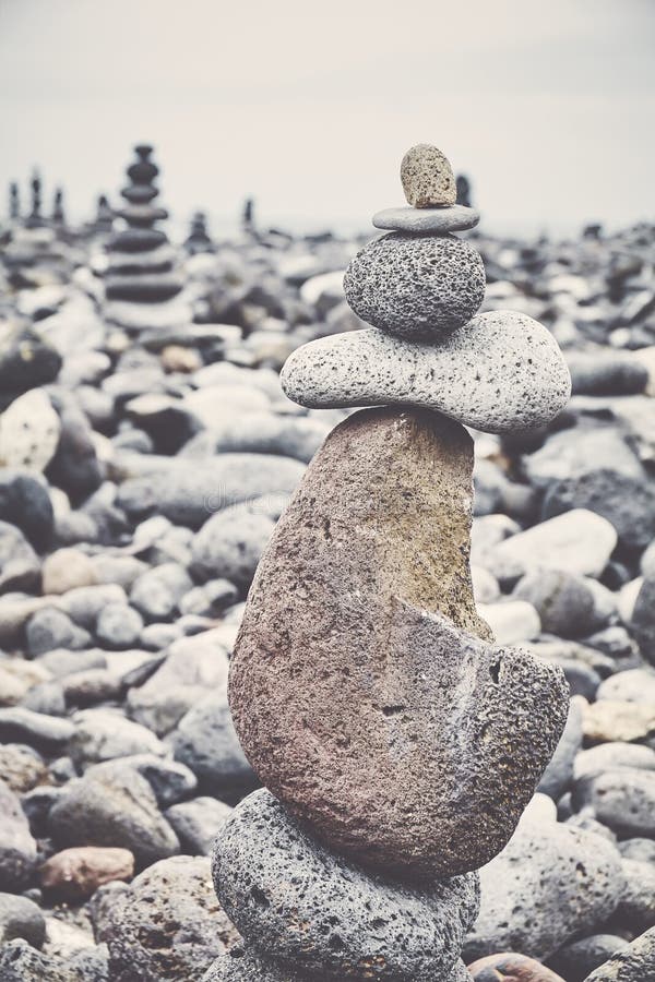 Color Toned Picture of a Volcanic Stones Stack on a Beach Stock Image ...