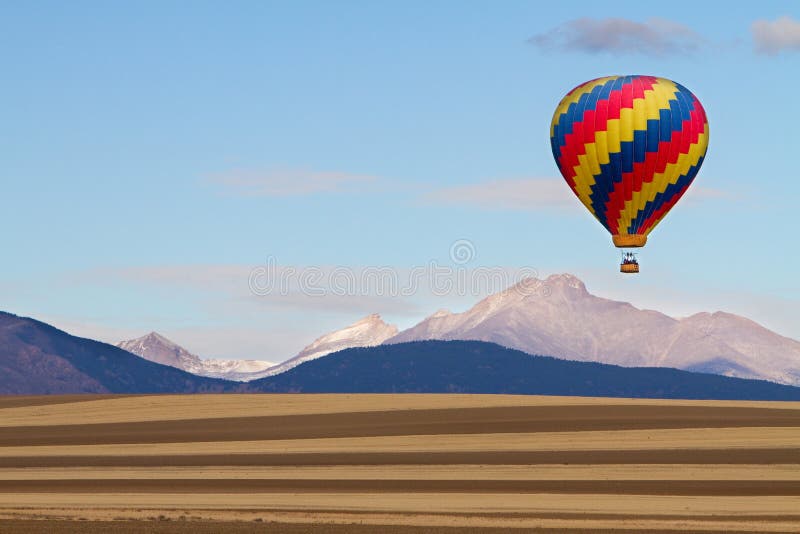 Hot Air Balloons Passing Over Mountains in Colorado Stock Photo - Image ...