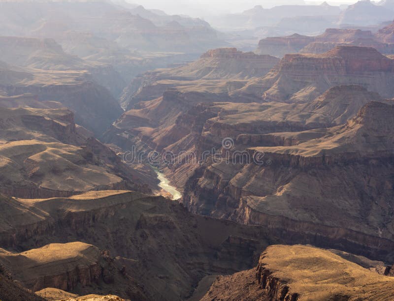 Colorado River Flows through the Middle of the Hazy Grand Canyon Stock ...