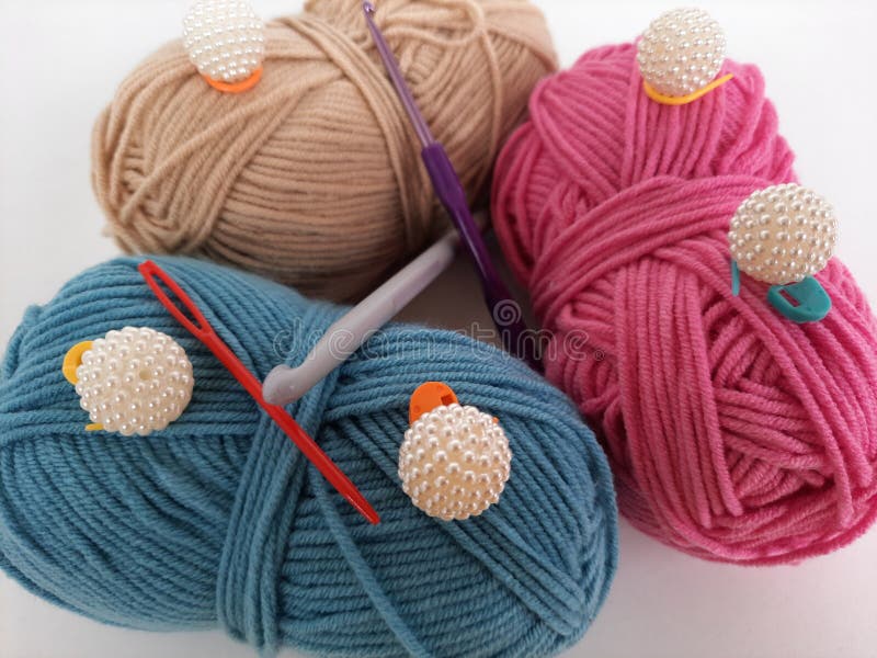 Colored Balls of Crochet Thread, Scissors and a Needle on a White ...