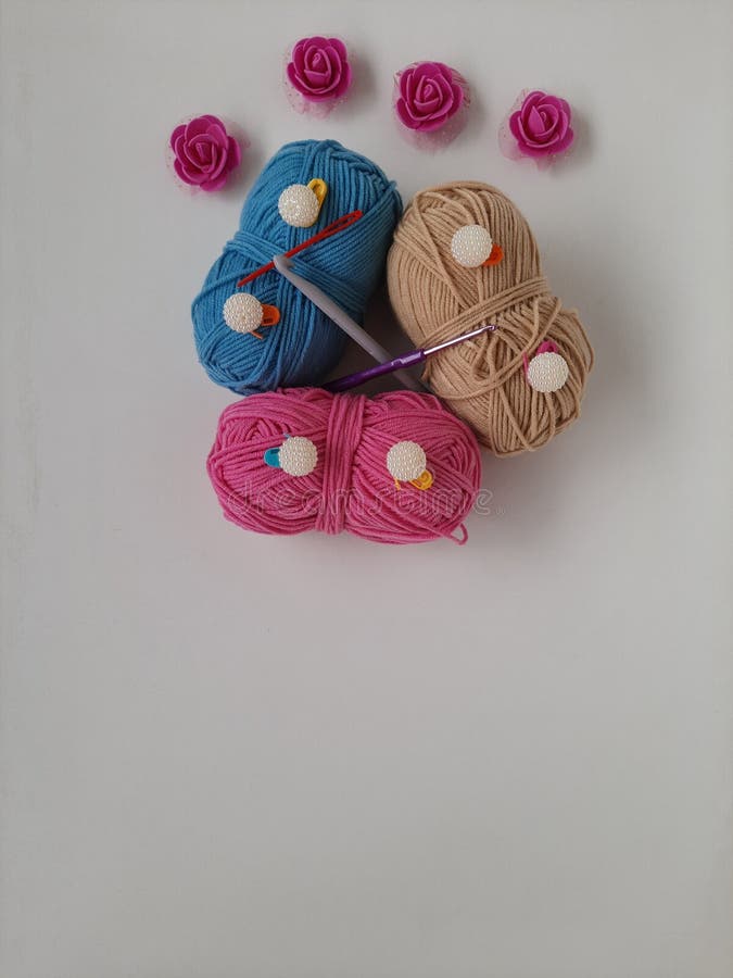 Colored Balls of Crochet Thread, Scissors and a Needle on a White ...