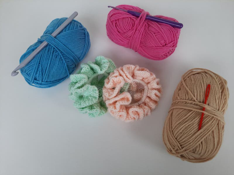 Colored Balls of Crochet Thread, Scissors and a Needle on a White ...