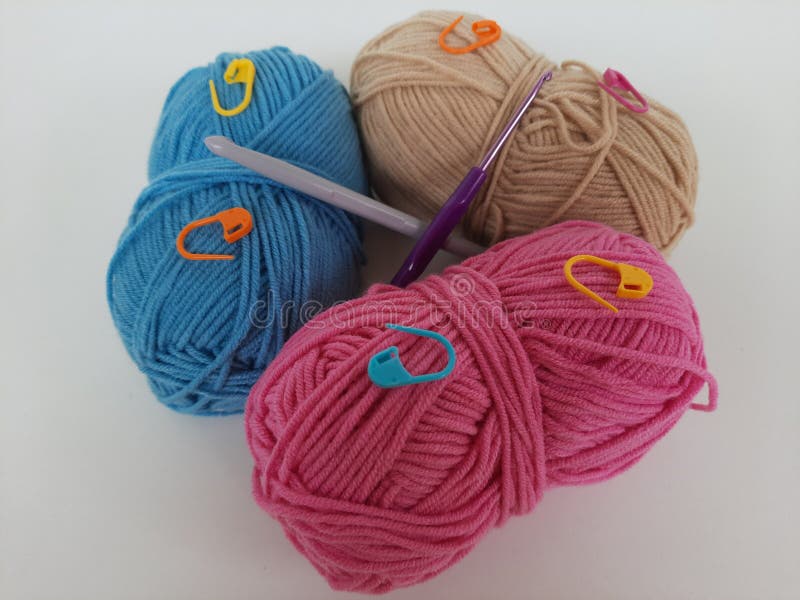 Colored Balls of Crochet Thread, Scissors and a Needle on a White ...