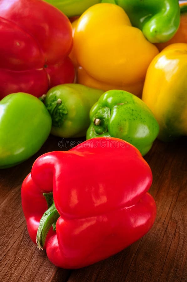 Colored Bell Peppers on Wooden Table Stock Image - Image of diet, plant ...
