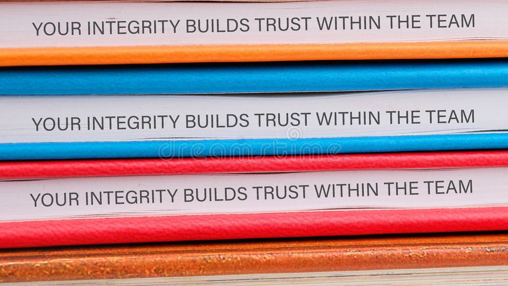 Colored Binders Stacked on a Surface Display the Message Emphasizing ...