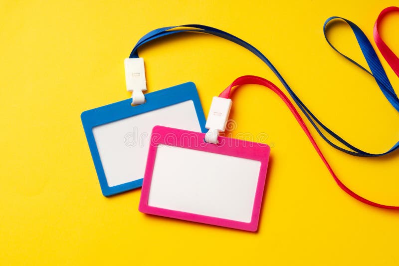 Colored Blank Nametags on Strings on Yellow Background Stock Photo ...
