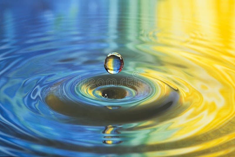 Colored Water Splash, Background of a Drop Falling into the Water Stock ...