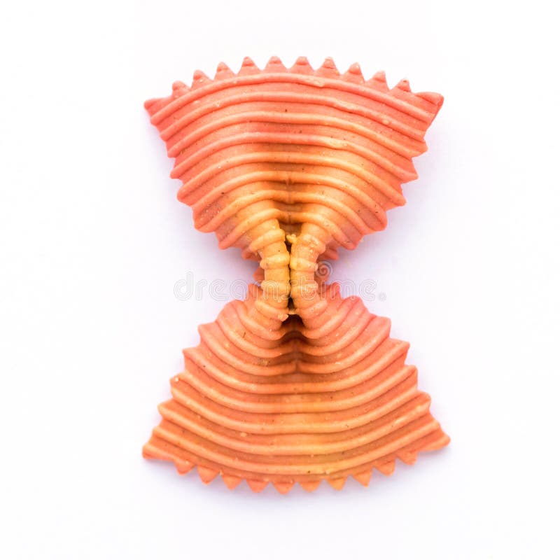 Colored Bow Tie Pasta. Closeup Single Orange Farfalle on White ...