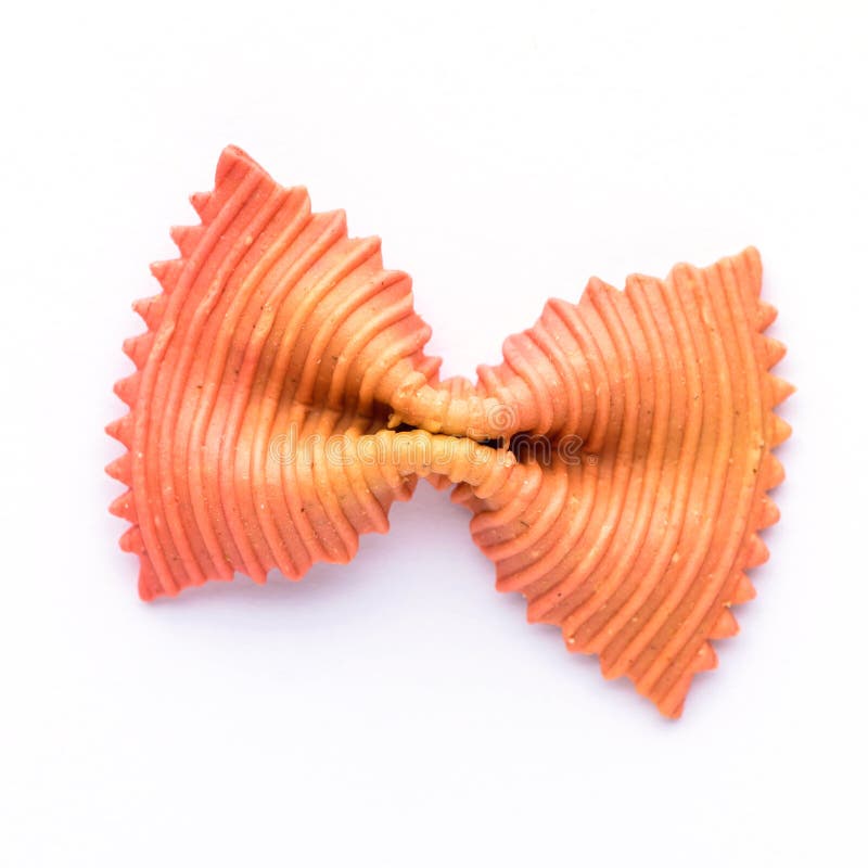 Colored Bow Tie Pasta. Closeup Single Orange Farfalle on White ...
