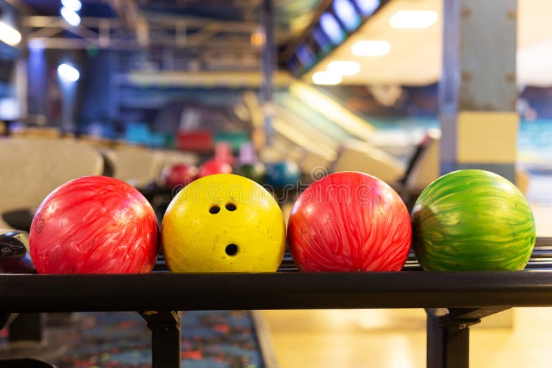 Colored Bowling Balls on Their Rail Stock Image - Image of color ...