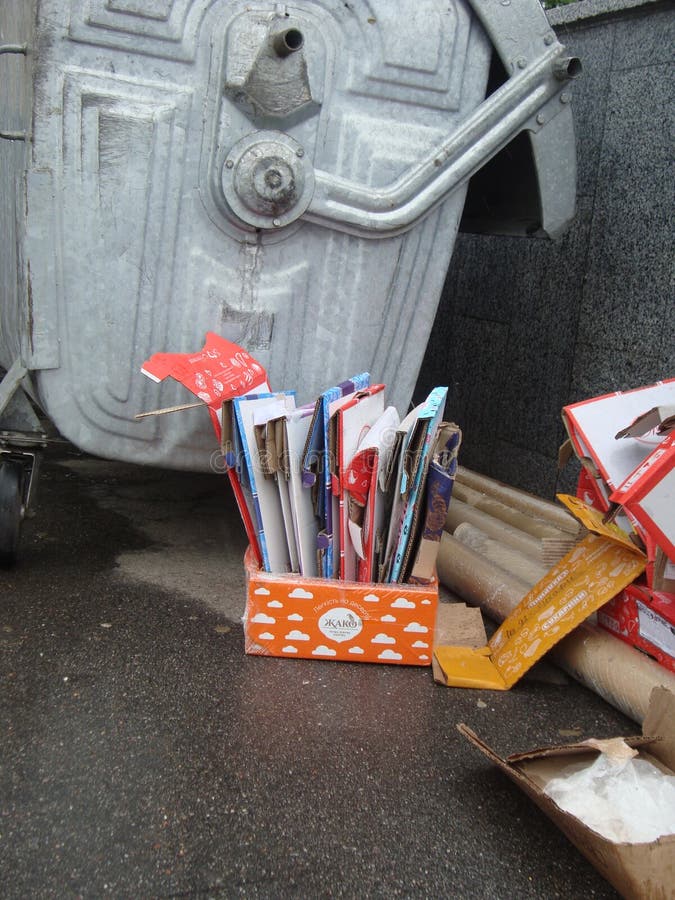 A Garbage Iron Container with Colored Boxes Alongside Stock Photo ...