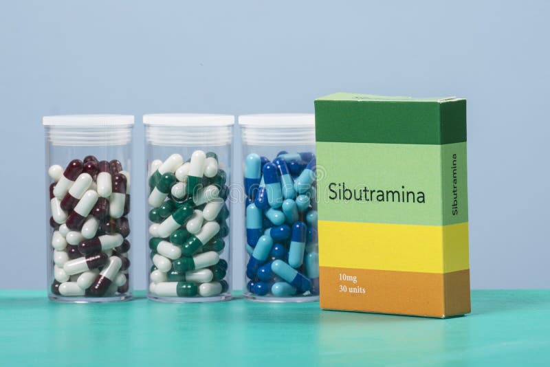 Colored Capsule of Medication in Transparent Plastic Storage Container ...