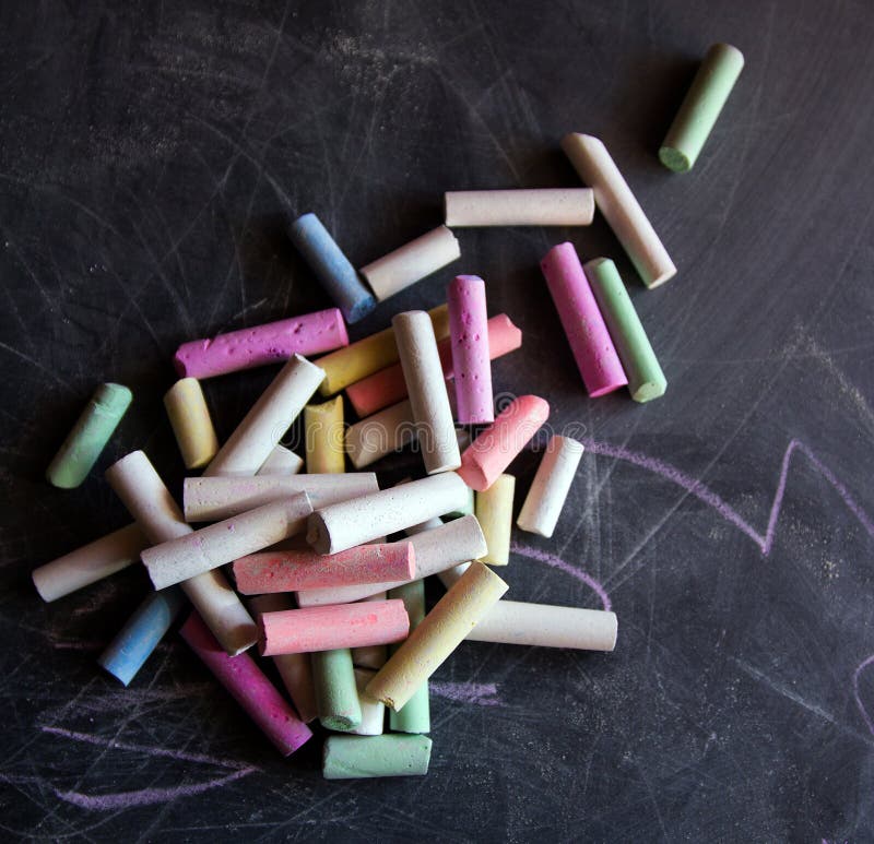 Colored Chalk on the Chalkboard Stock Photo - Image of background ...