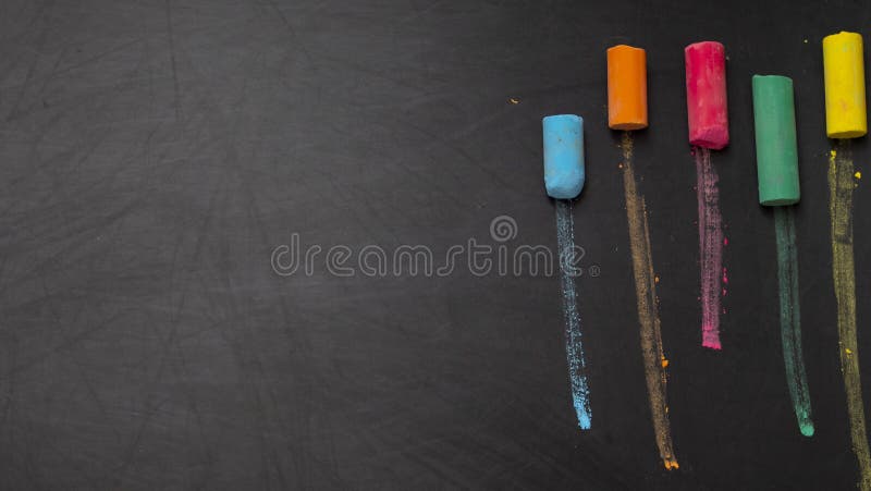 Colored Chalks on Black Chalkboard Stock Photo - Image of background ...