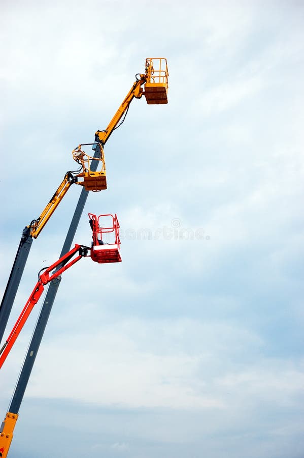 Colored cherry pickers stock image. Image of metal, industrial - 9876679