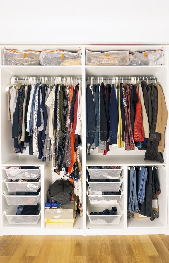 Colored Clothes in the Closet. Storage of Clothes and Things in the ...