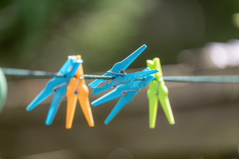 Colored Clothespins for Drying Clothes Outdoors on a Clothesline Stock ...