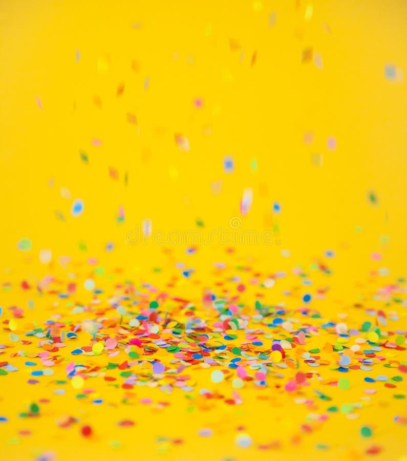 Colored Confetti Flying on Yellow Background Stock Image - Image of ...