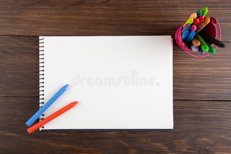 Colored Crayons and Blank Page on the Wooden Table Stock Image - Image ...