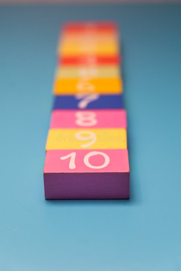 Colored Cubes with Numbers on a Blue Background Stock Image - Image of ...