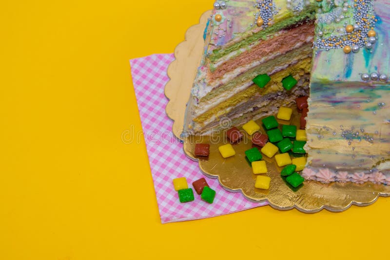 Colored Cut Cake on a Yellow Background Stock Photo - Image of ...
