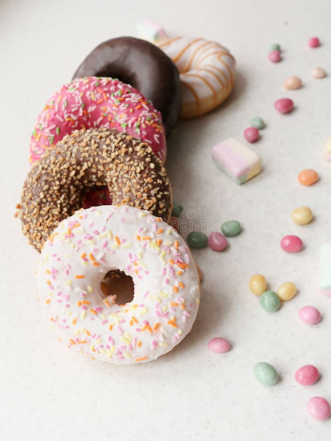 Colored Donuts on a Light Background Stock Image - Image of cooking ...