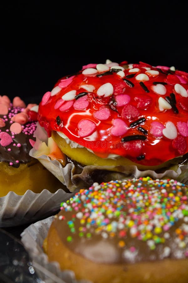 Colored Donuts and a Red One Stock Photo - Image of icing, fried: 196342002